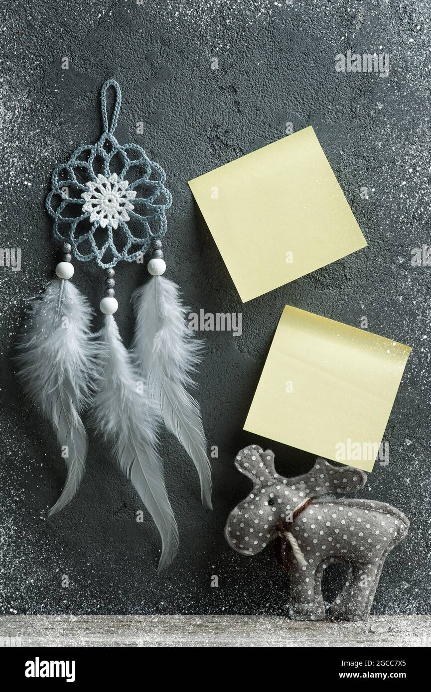 Yelow empty sticky note on concrete wall with christmas decorations ...