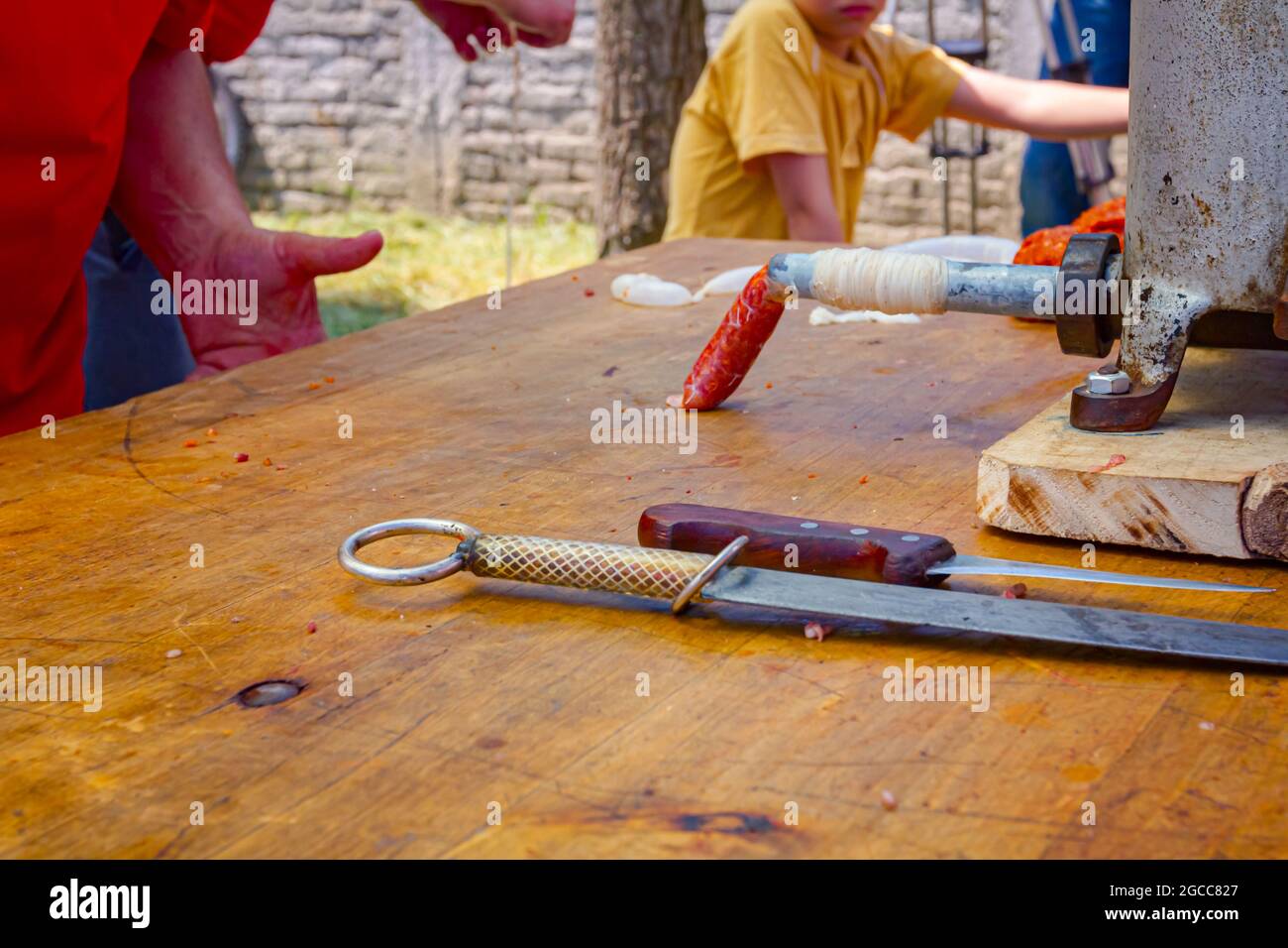 Fill up pig intestines to make sausage with machine for handmade ...