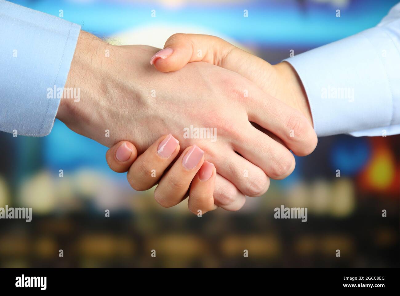 Business handshake on bright background Stock Photo - Alamy