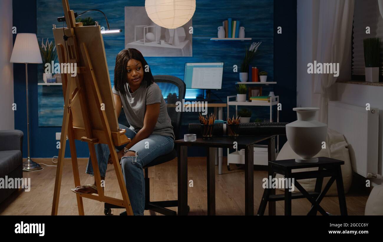 Adult of african american ethnicity working on fine art concept in ...