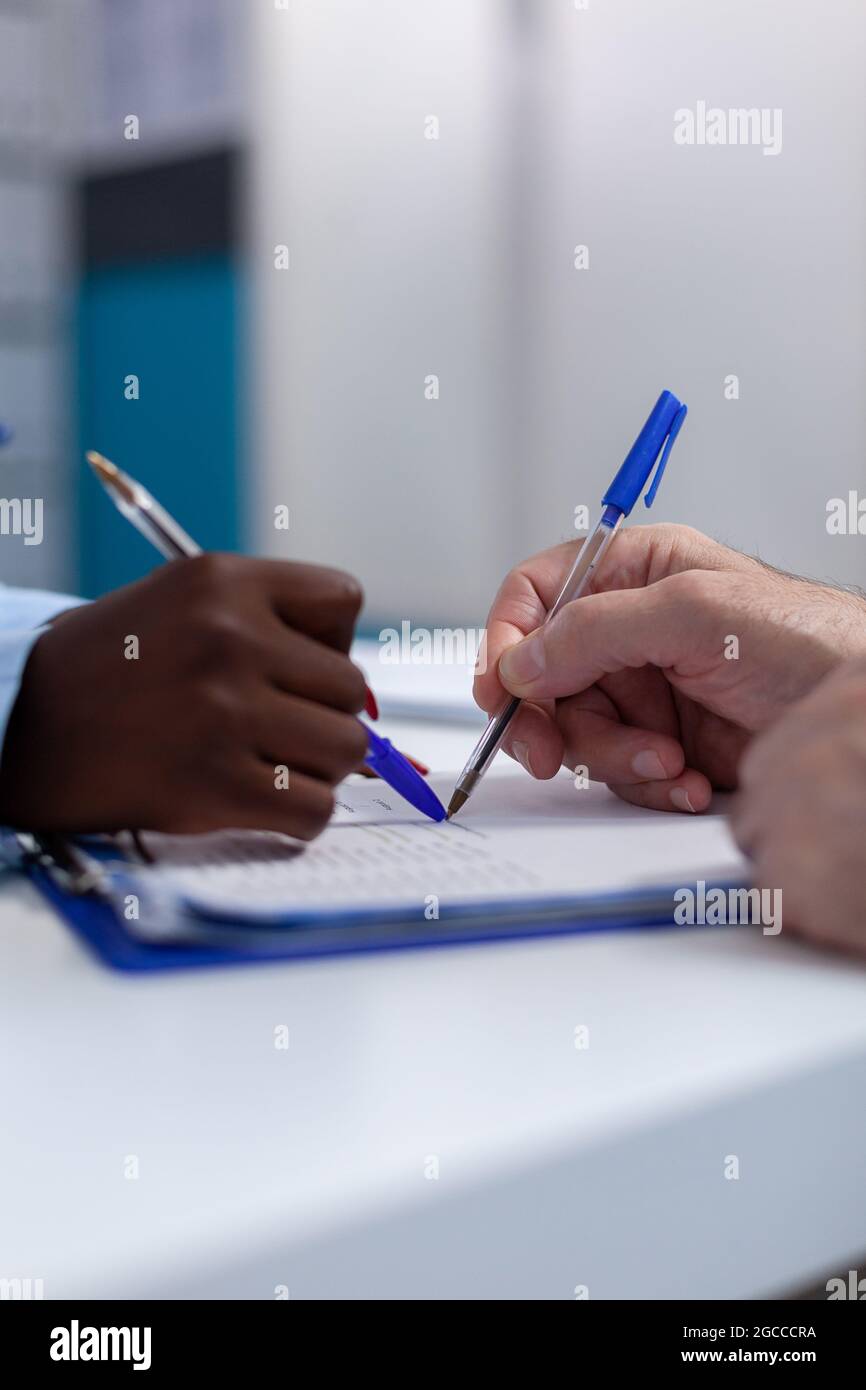 Elderly man signing papers hi-res stock photography and images - Alamy