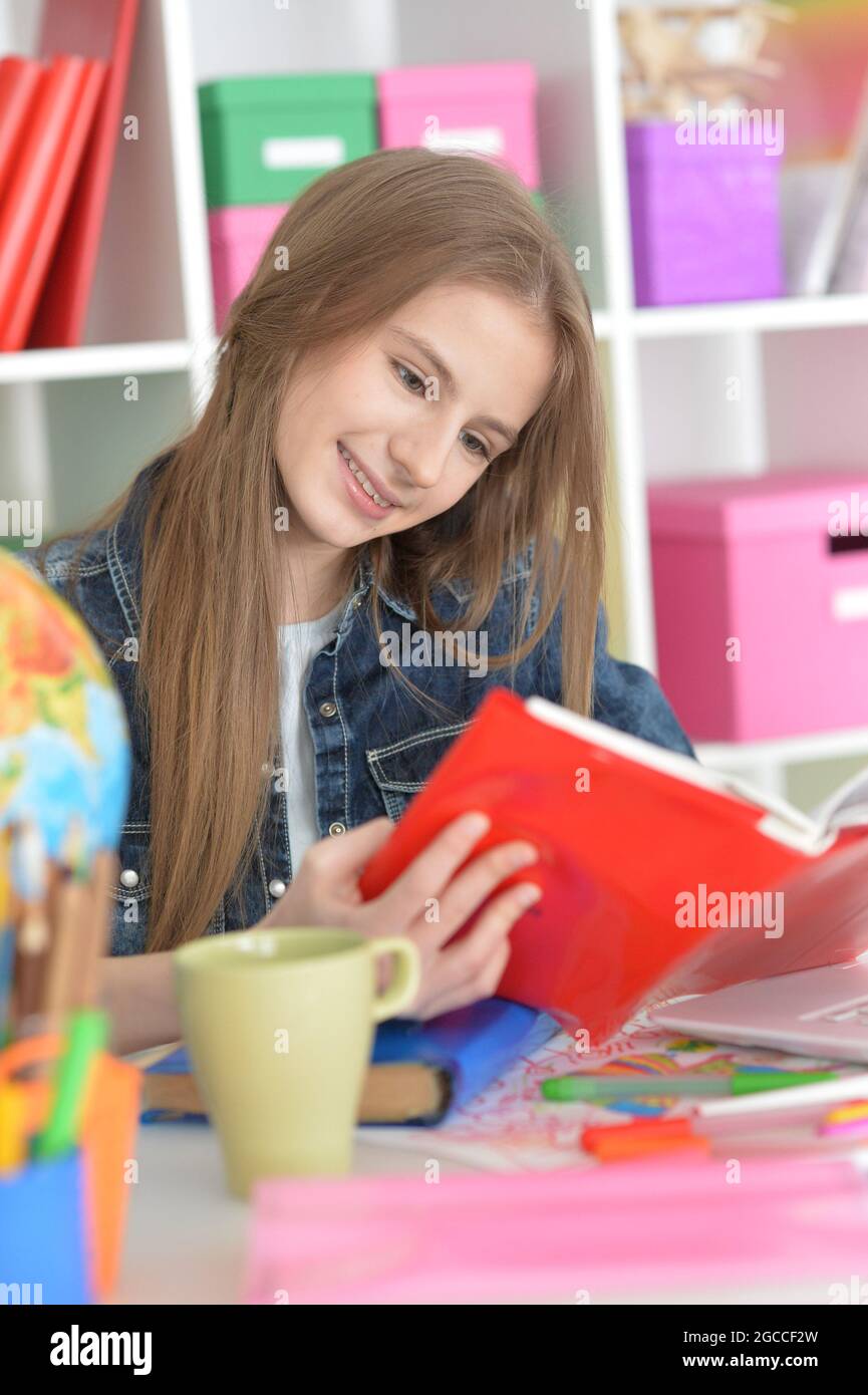 Portrait of beautiful girl with a book Stock Photo - Alamy