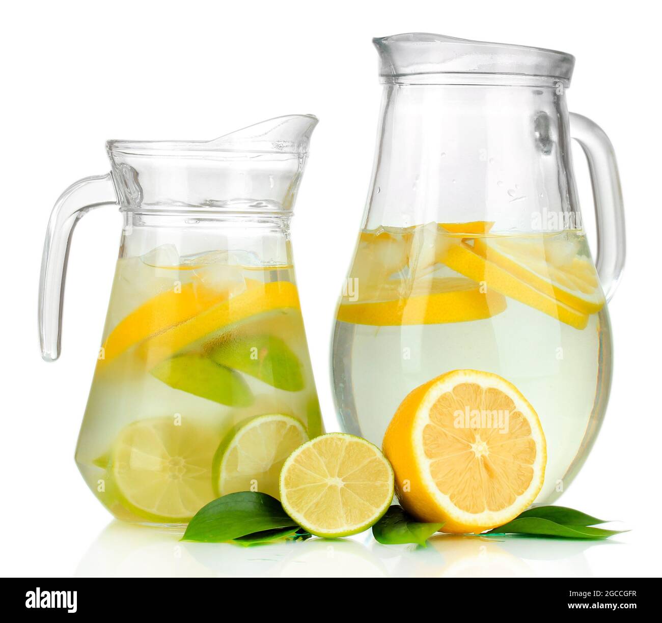 Cold water with lime, lemon and ice in pitchers isolated on white Stock ...