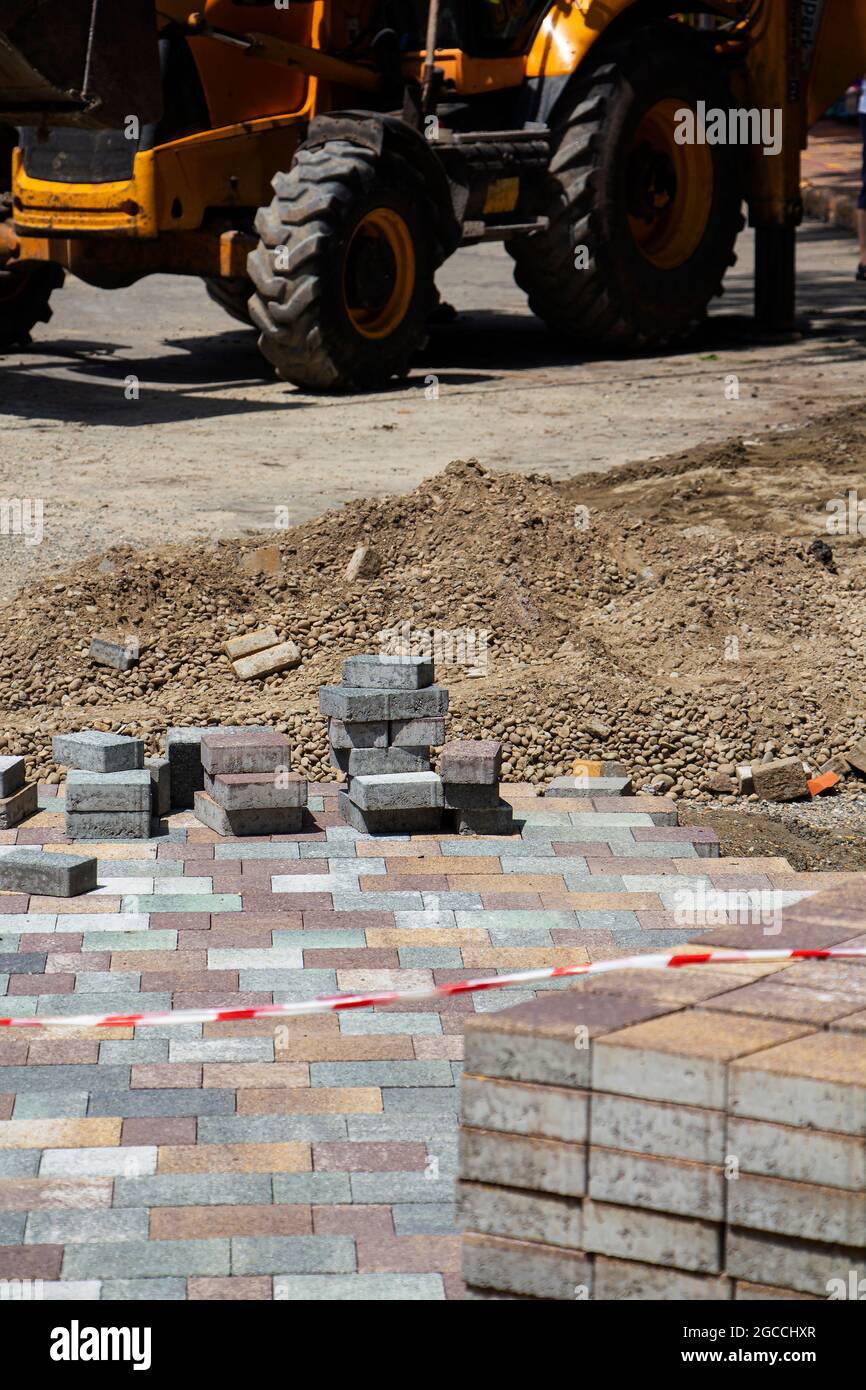 Process of construction of brick paved sidewalk, half built pavement ...