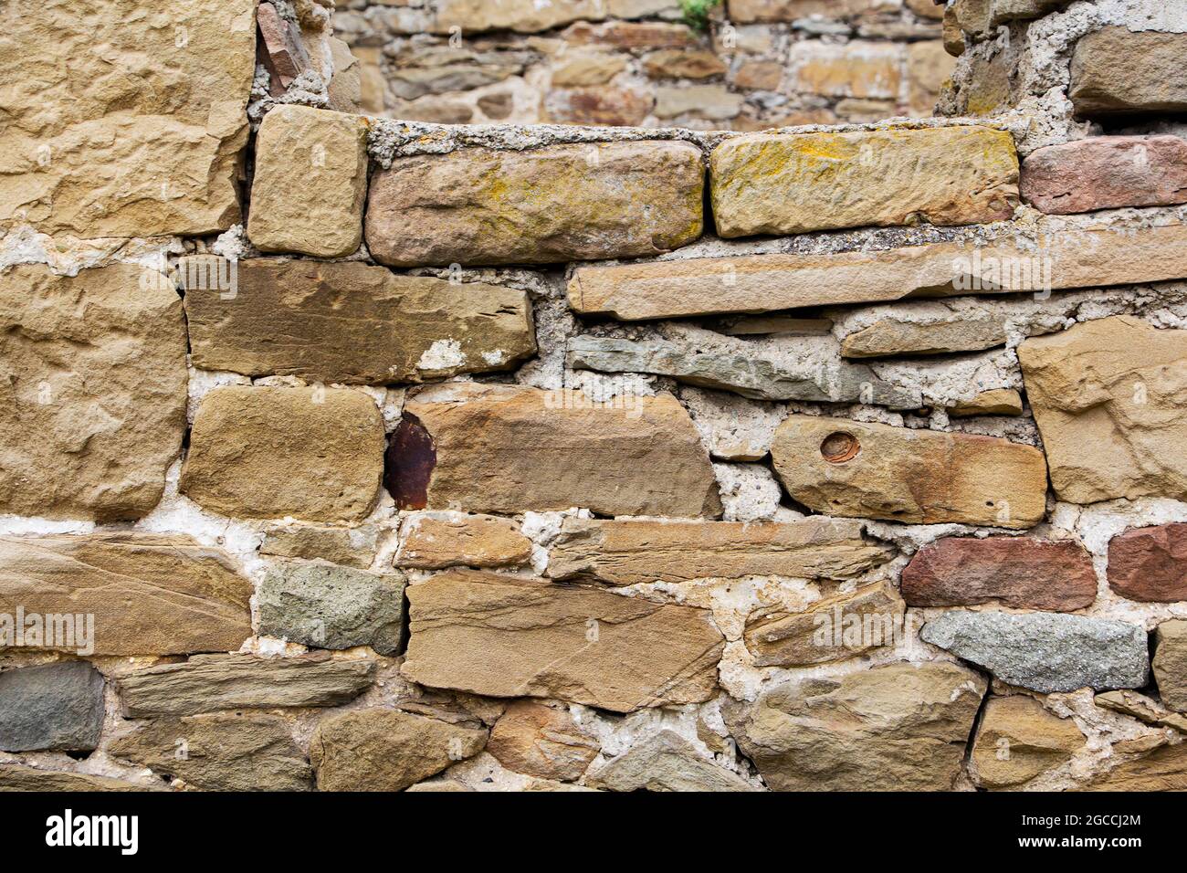 The rough textured surface of the wild stone wall. Background Stock ...