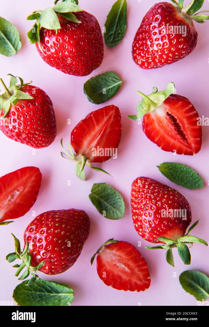 Fresh ripe delicious strawberries on a pink background Stock Photo - Alamy
