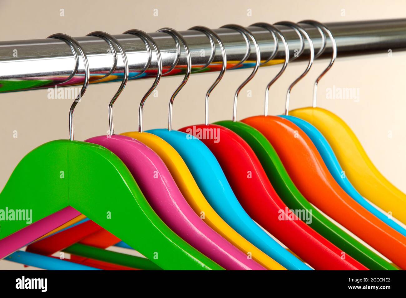 Colorful clothes hangers on gray background Stock Photo - Alamy