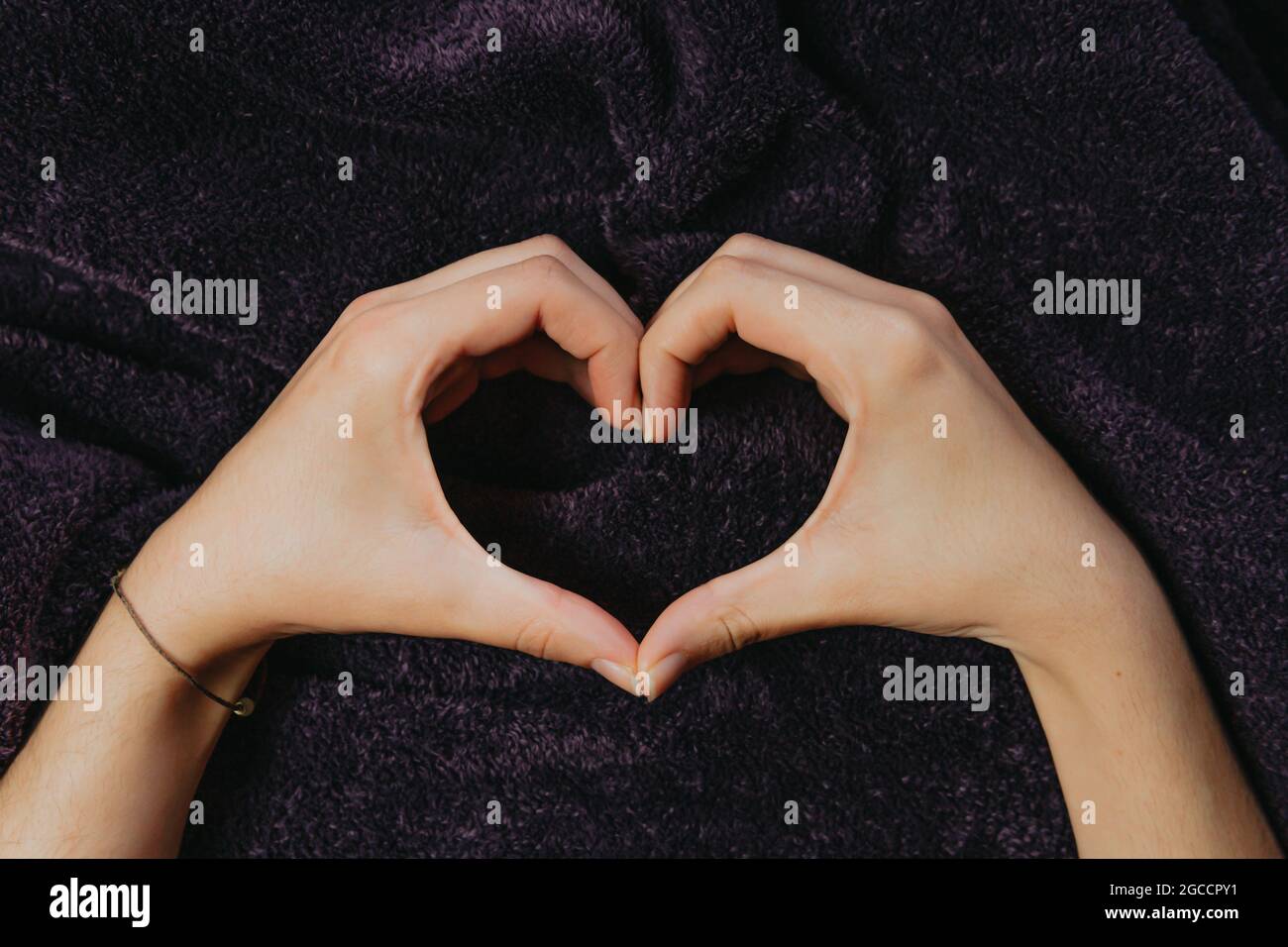 A female's hands shaping a heart on a furry background Stock Photo - Alamy