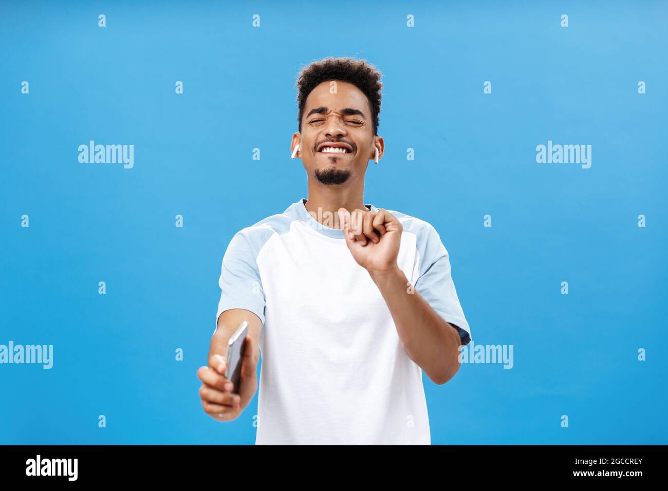 Man biting lip phone hi-res stock photography and images - Alamy