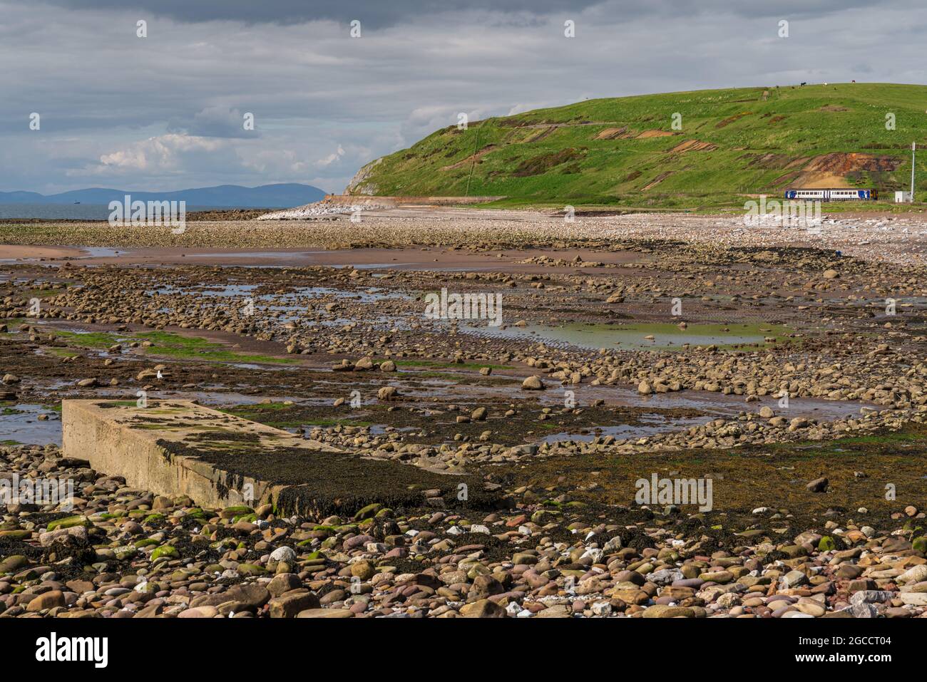 Parton, Cumbria, England, UK - May 03, 2019: A train passing Parton Bay ...