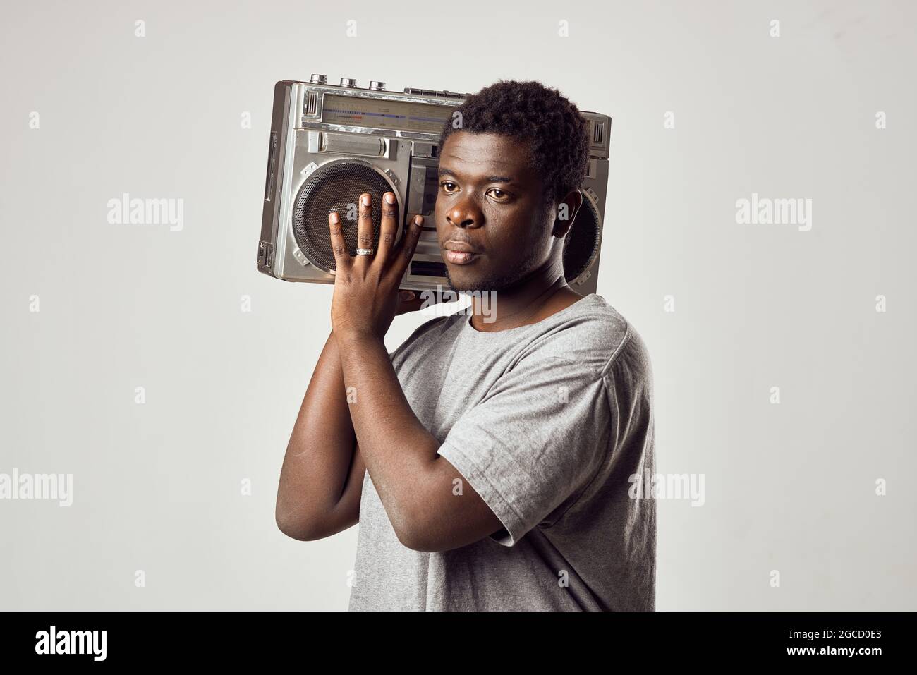 man with a tape recorder in his hands listening to music african ...