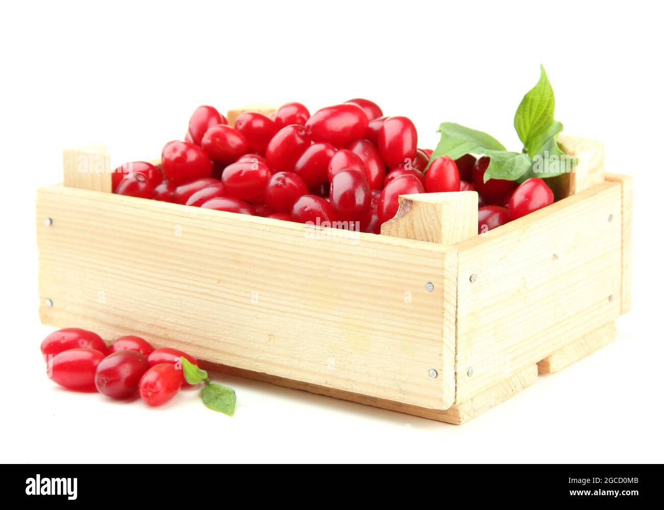 Fresh cornel berries in wooden crate, isolated on white Stock Photo - Alamy