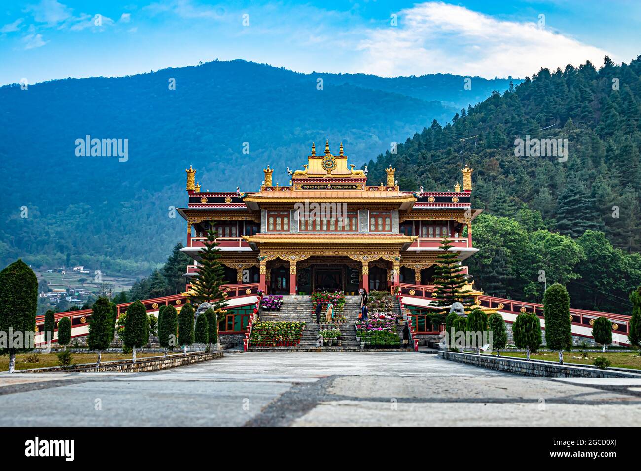 buddhist monastery at himalayan mountain foothills at morning from flat ...