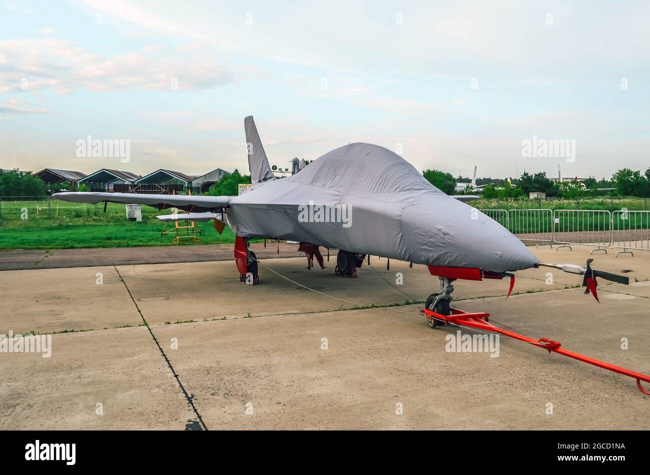 fighters jet covered with a cloth cover in the parking Stock Photo - Alamy