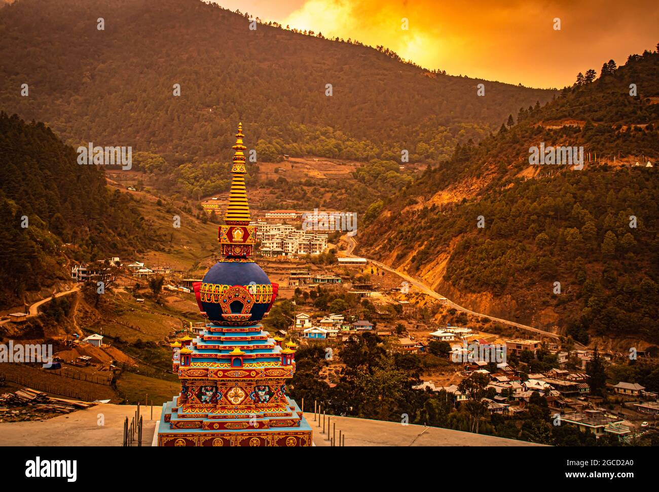 Buddhist stupa with himalayan mountain background and dramatic sky at ...