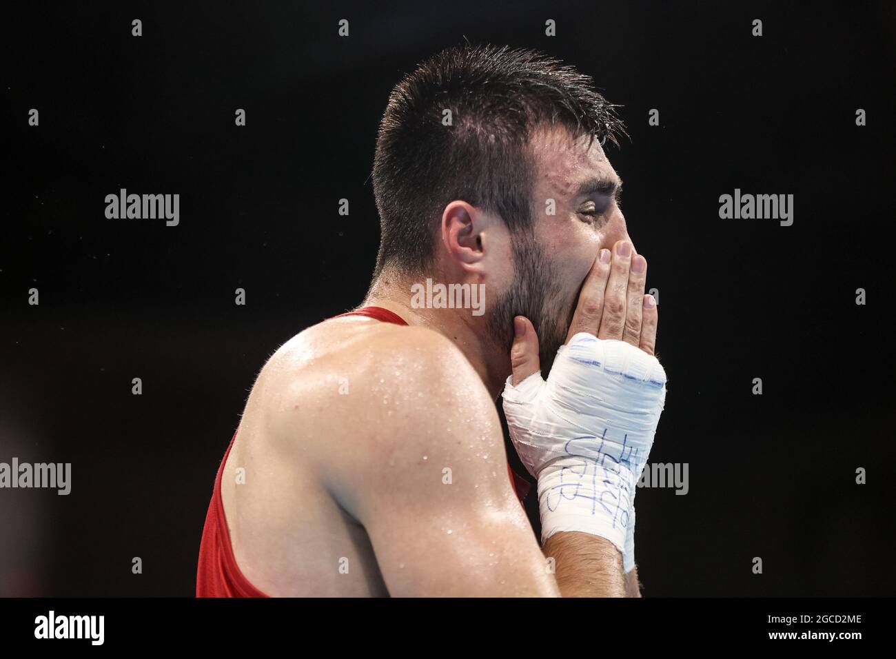 Tokyo, Japan. 8th Aug, 2021. Bakhodir Jalolov of Uzbekistan reacts ...