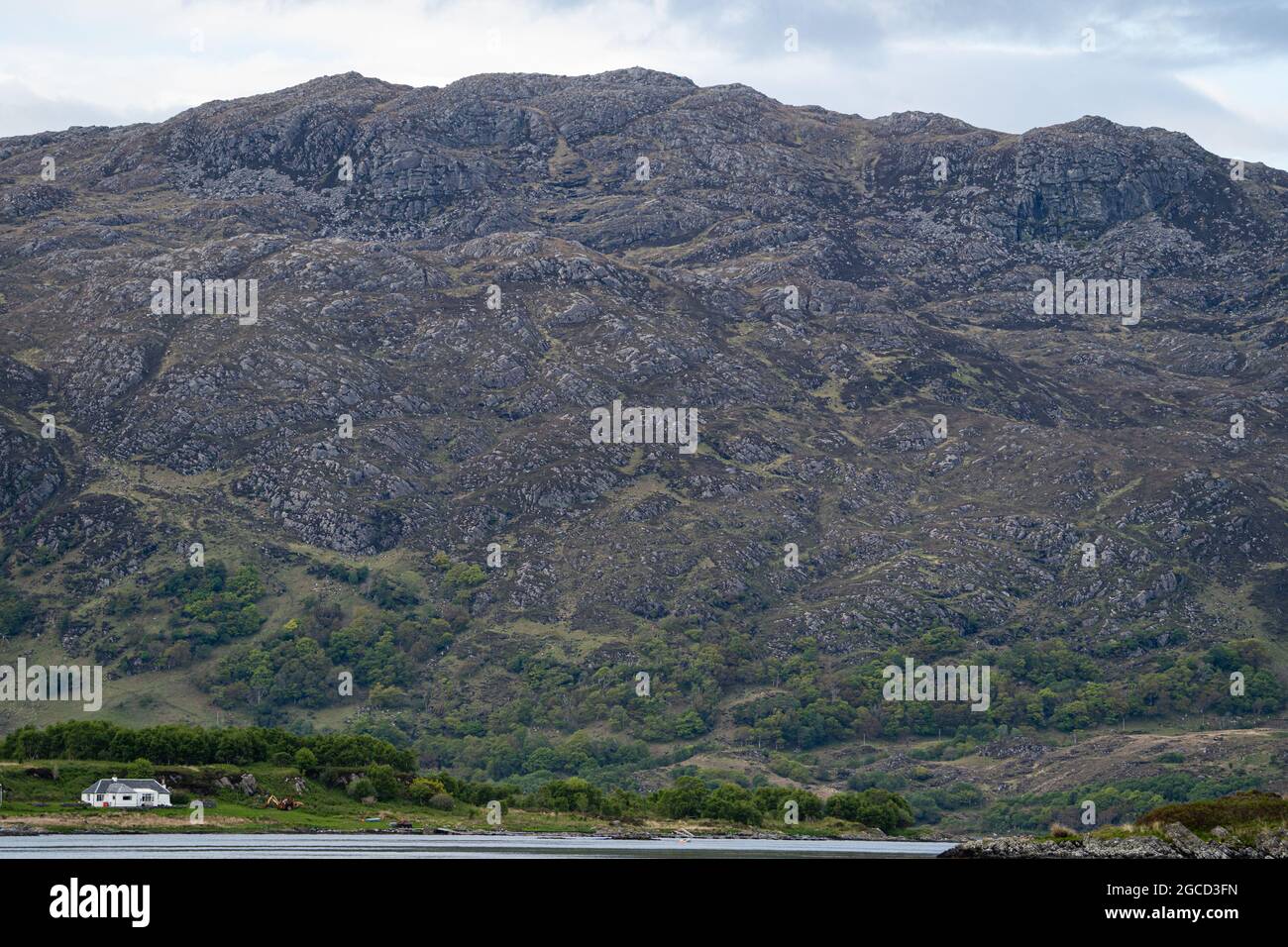 Rugged Highland mountains rising above coastal landscape on Isle of ...