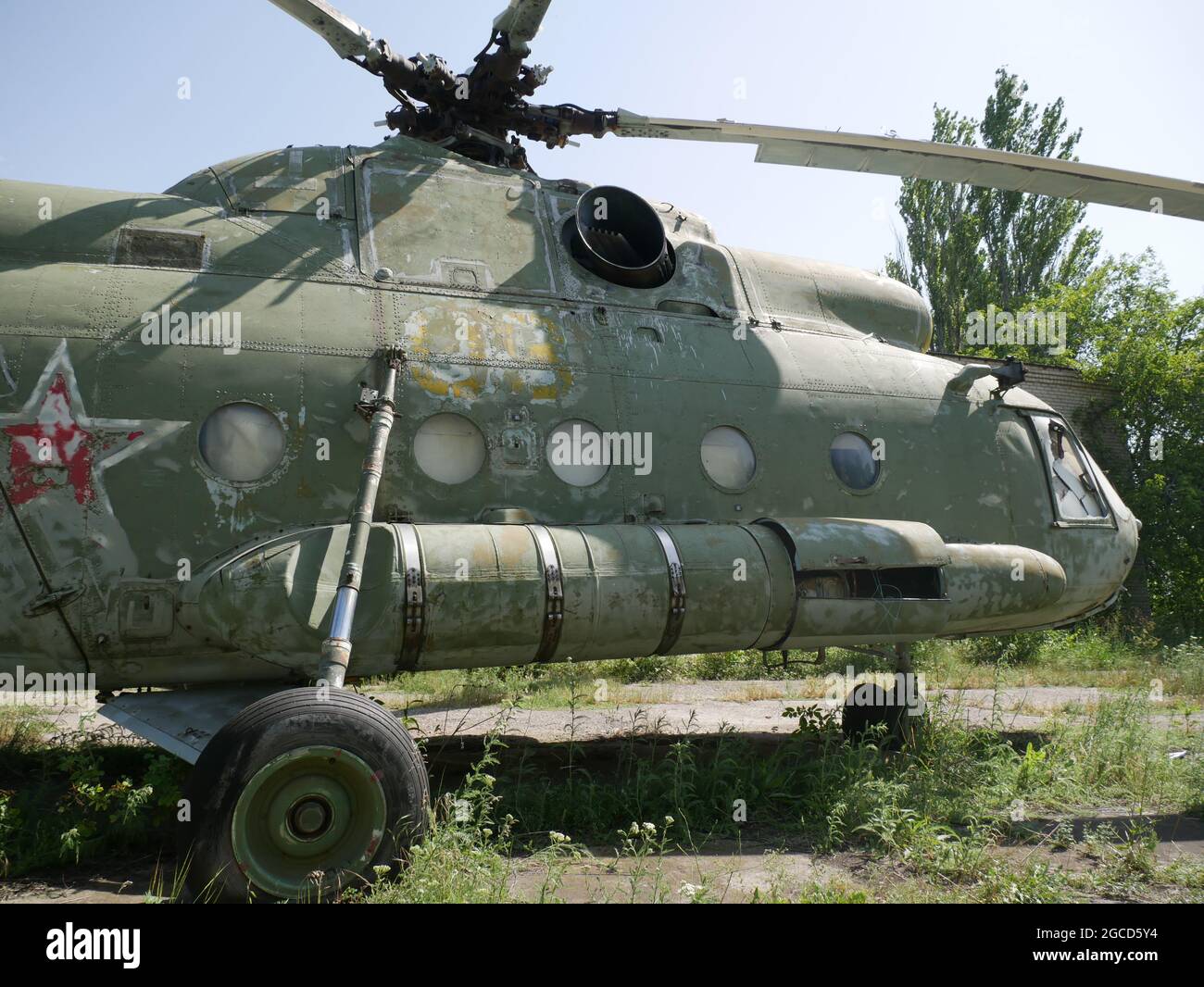 Old military abandoned helicopter. Broken non-working helicopter green ...