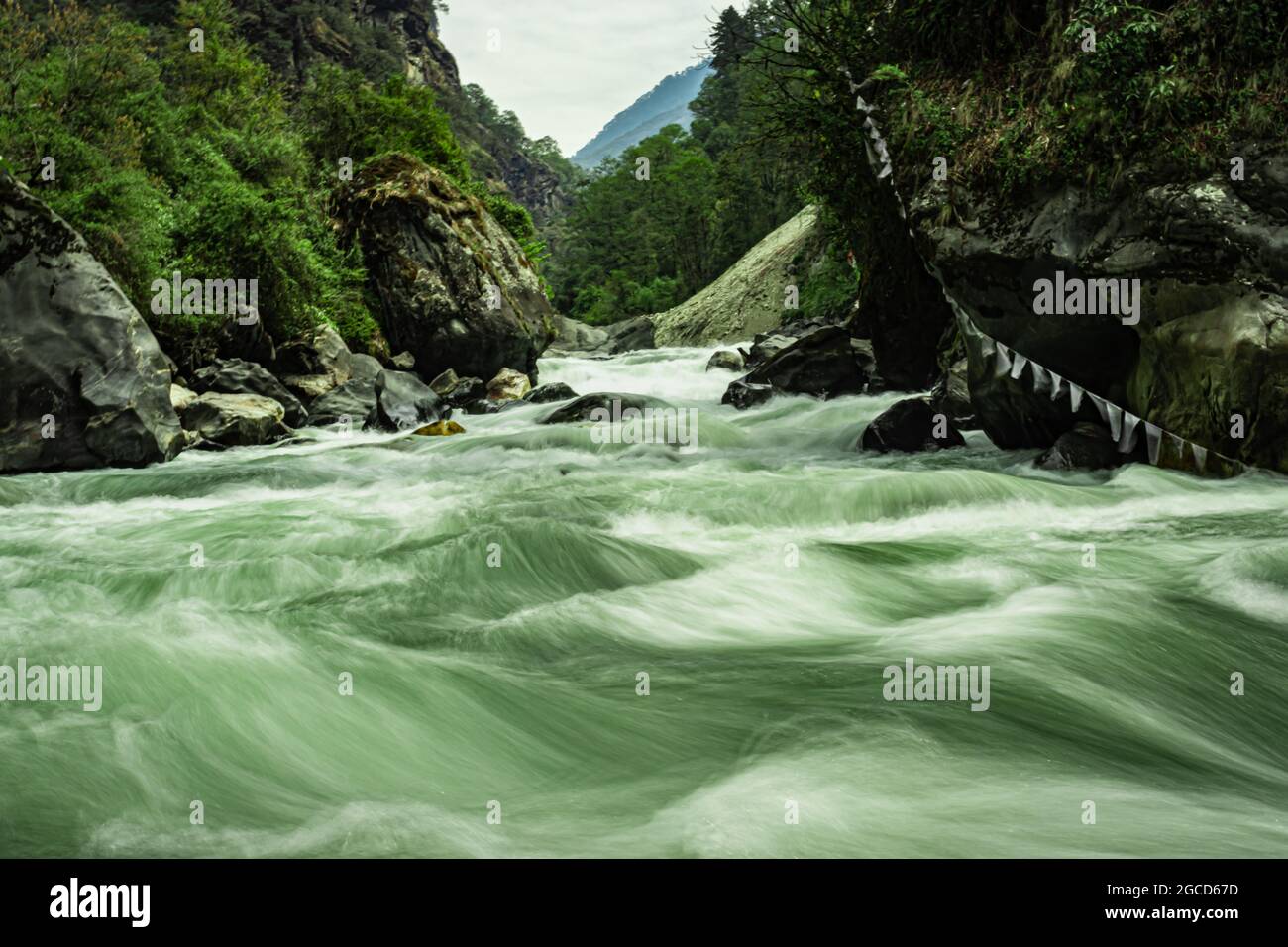 mountain river extreme water flow at day long exposure image is taken ...
