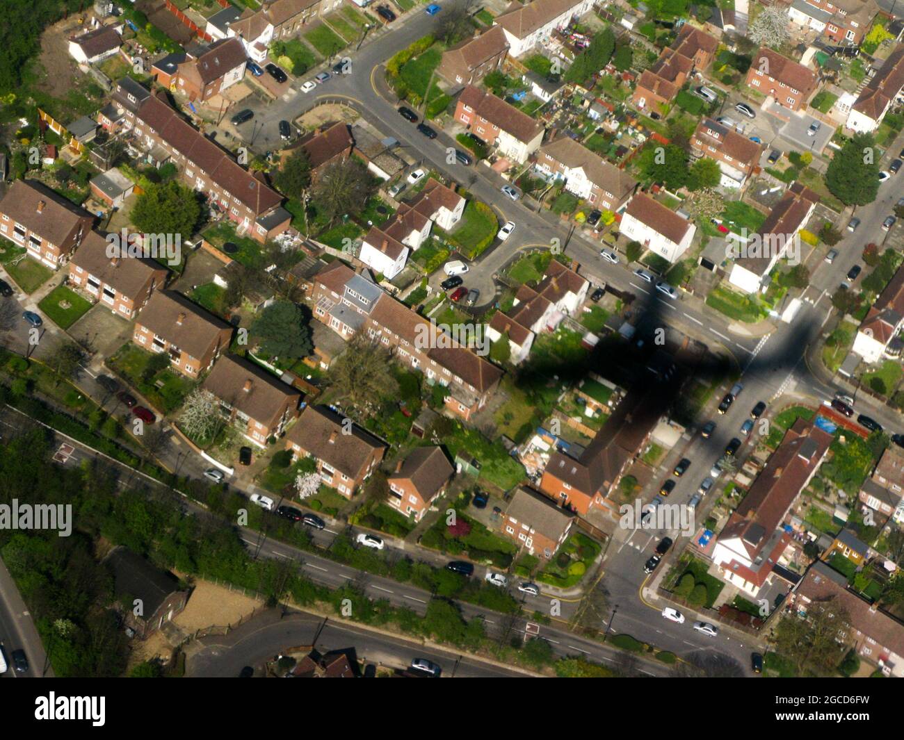 The shadow of a plane over suburban England Stock Photo - Alamy