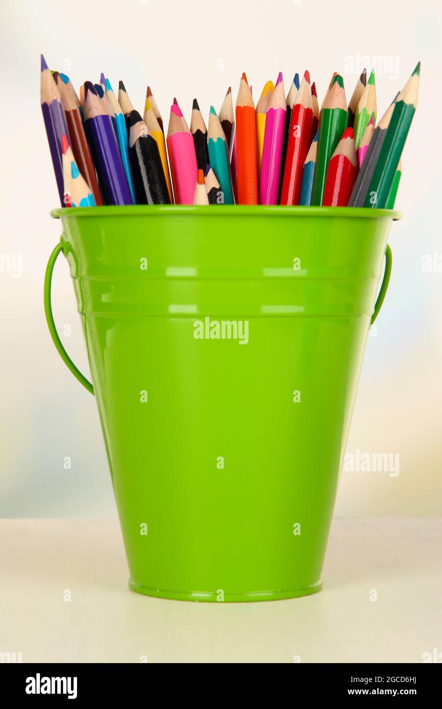 Color bucket with multicolor pencils, on color background Stock Photo ...