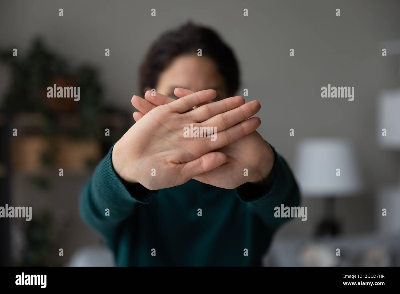 Close up woman showing stop or defense sign, saying no Stock Photo - Alamy
