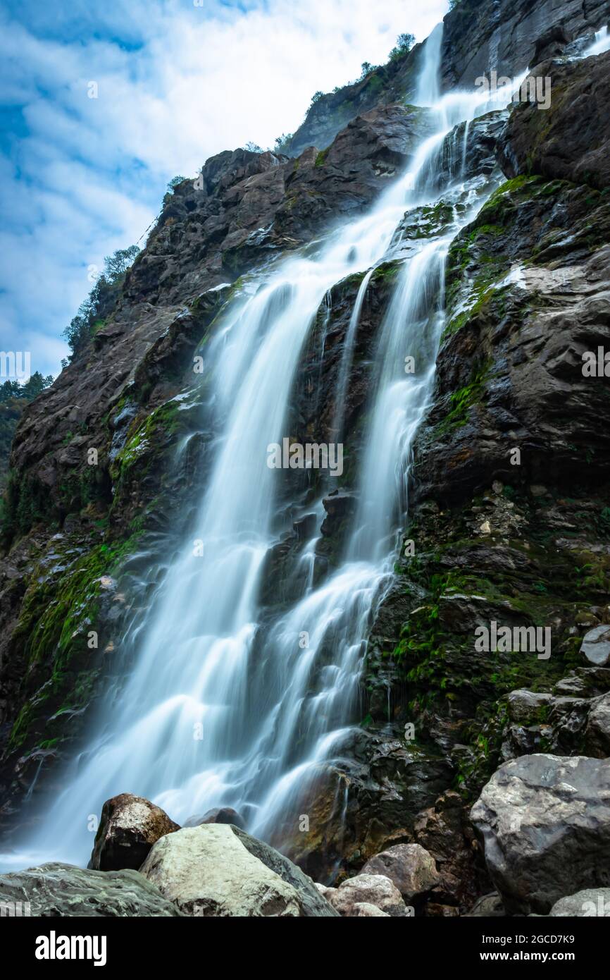 waterfall white water stream falling from mountains at day from flat ...