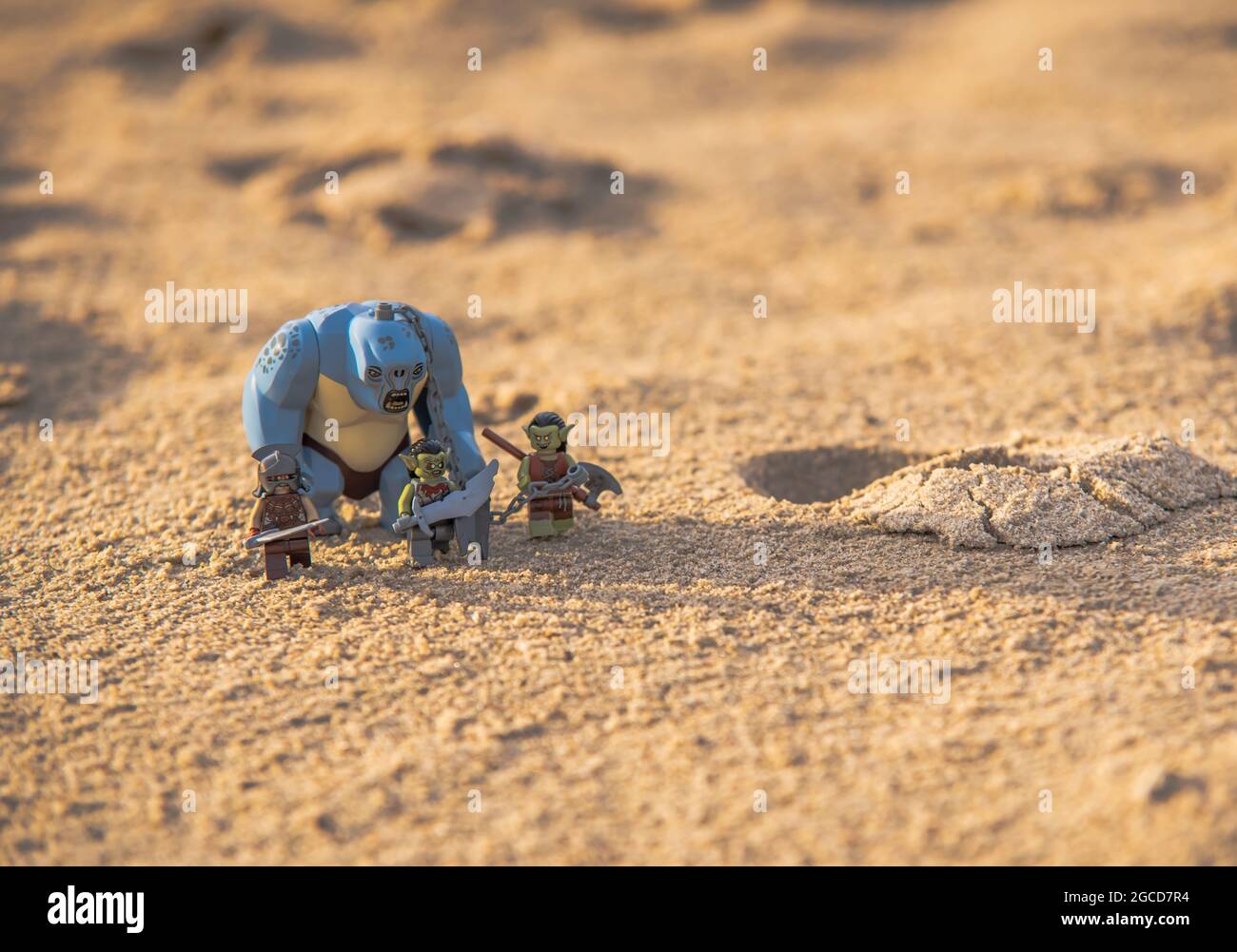 Lego orcs minifigures walking with cave troll Stock Photo - Alamy