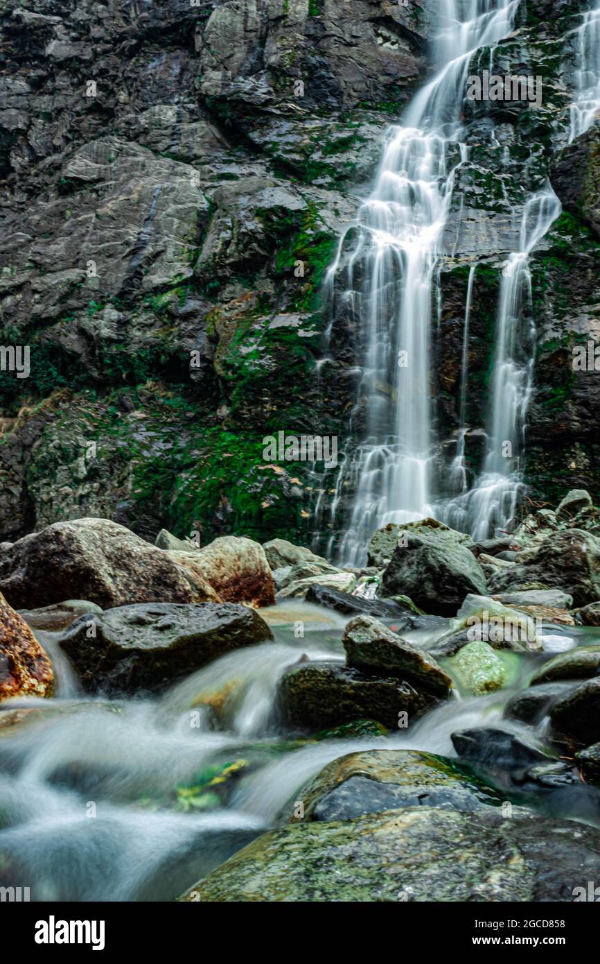 waterfall white water stream falling from mountains at day from low ...