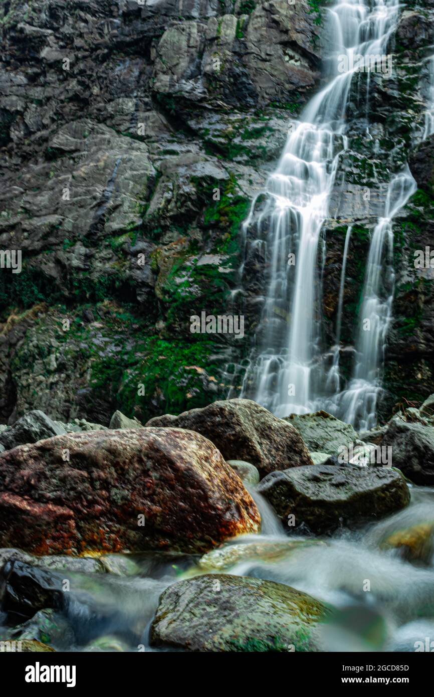 waterfall white water stream falling from mountains at day from low ...