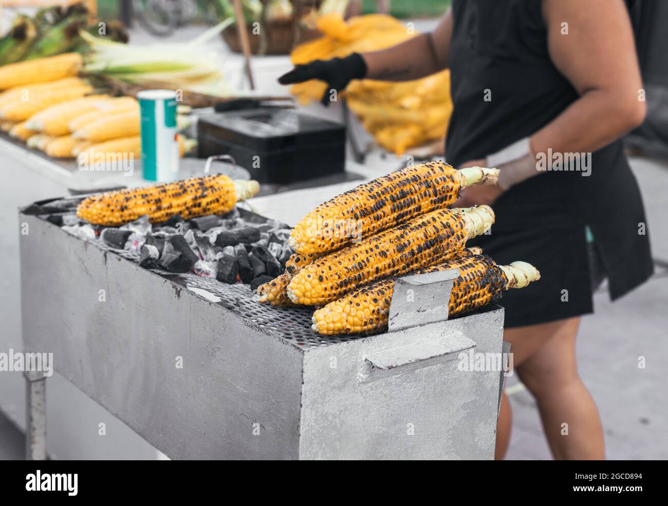 Some roasted corncobs at a street food stall Stock Photo - Alamy