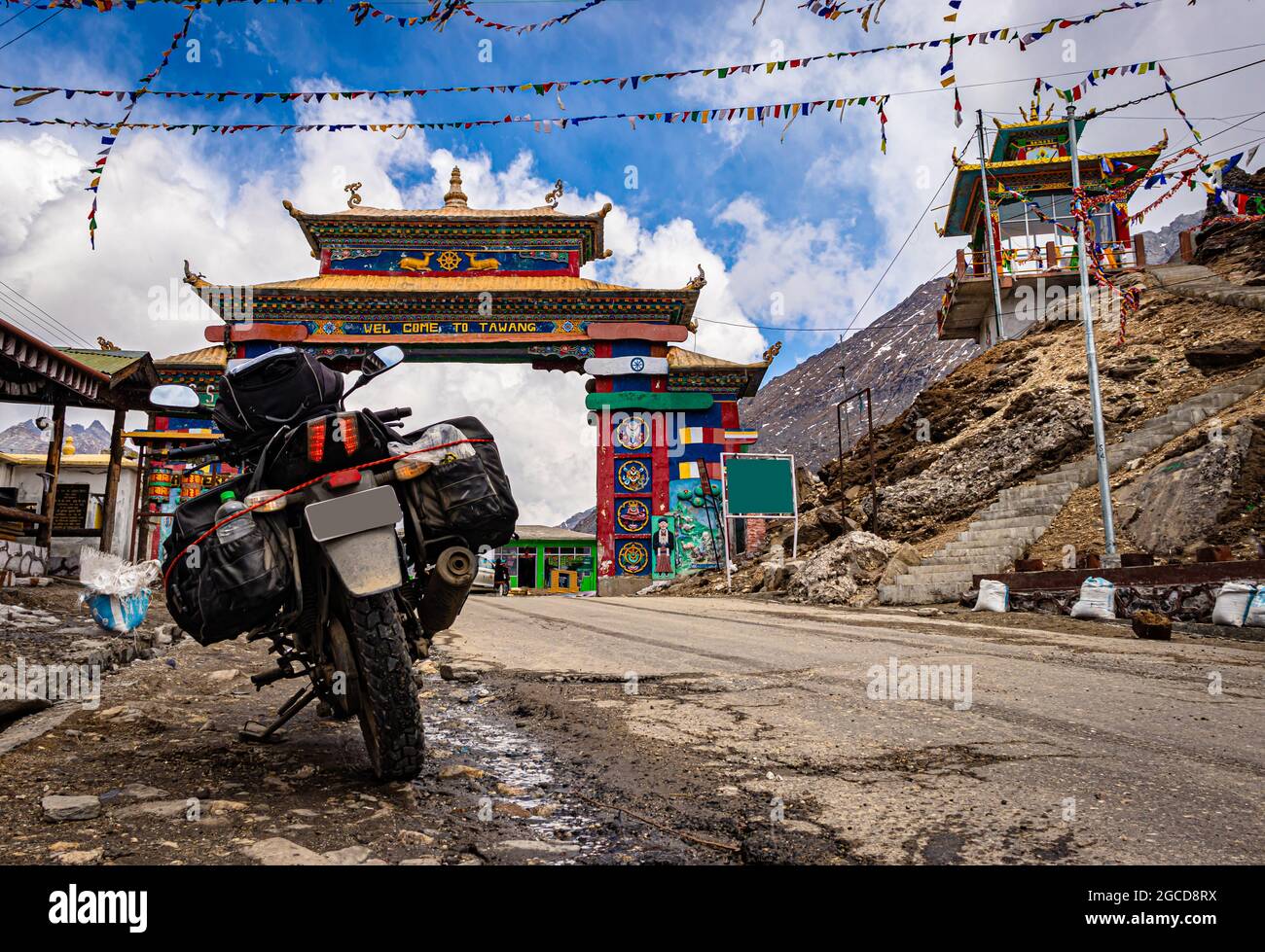 biker loaded motorcycle at mountain pass with bright blue sky at day ...