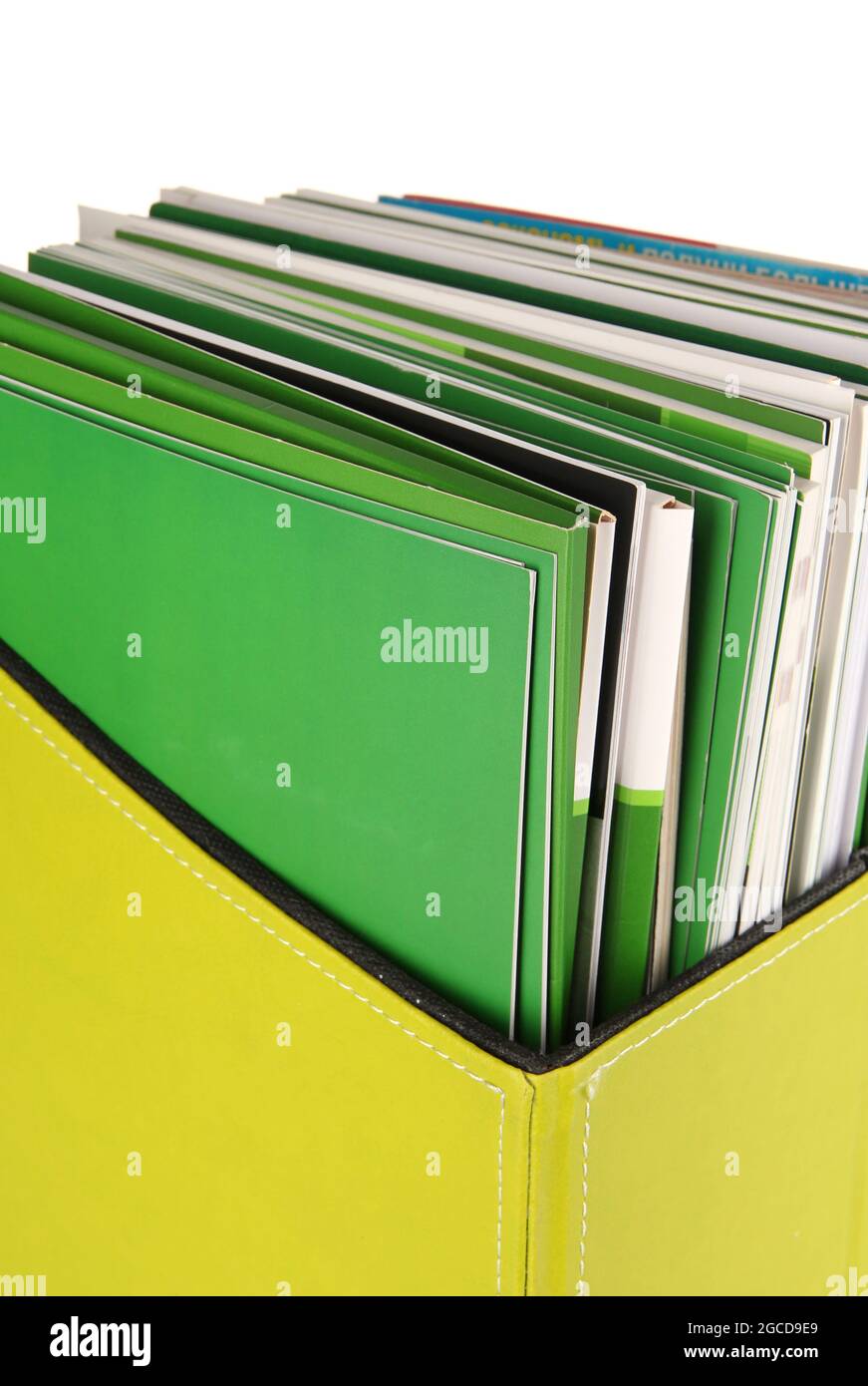Magazines and folders in green box, isolated on white Stock Photo - Alamy