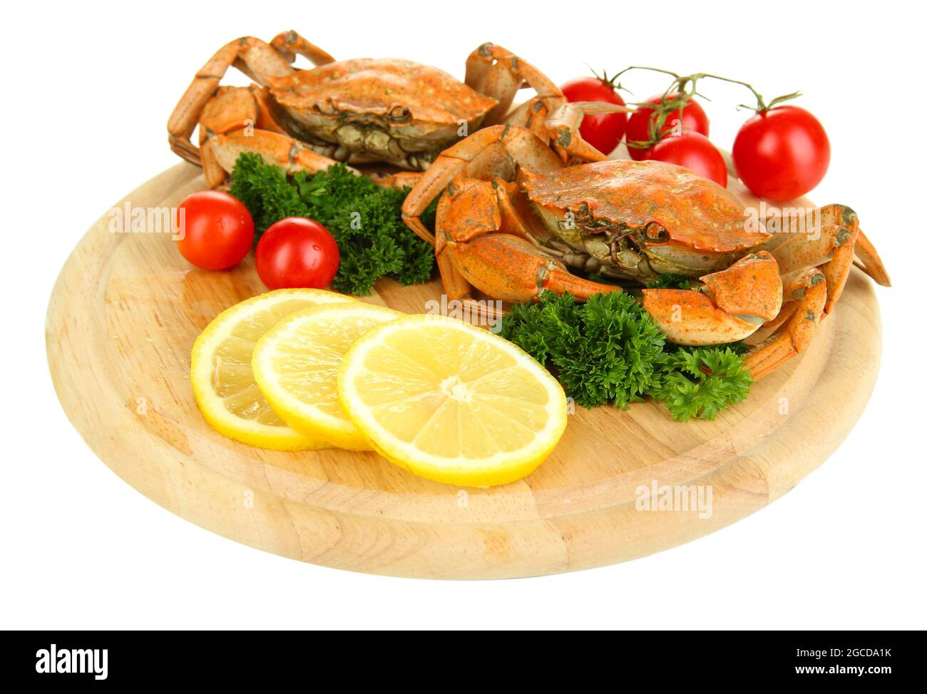 Boiled crabs with lemon slices and tomatoes, on wooden board, isolated on white Stock Photo - Alamy
