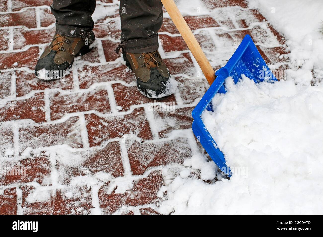 Man removing snow from the sidewalk after snowstorm. Winter time Stock ... Man removing snow from the sidewalk after snowstorm. Winter time Stock ...