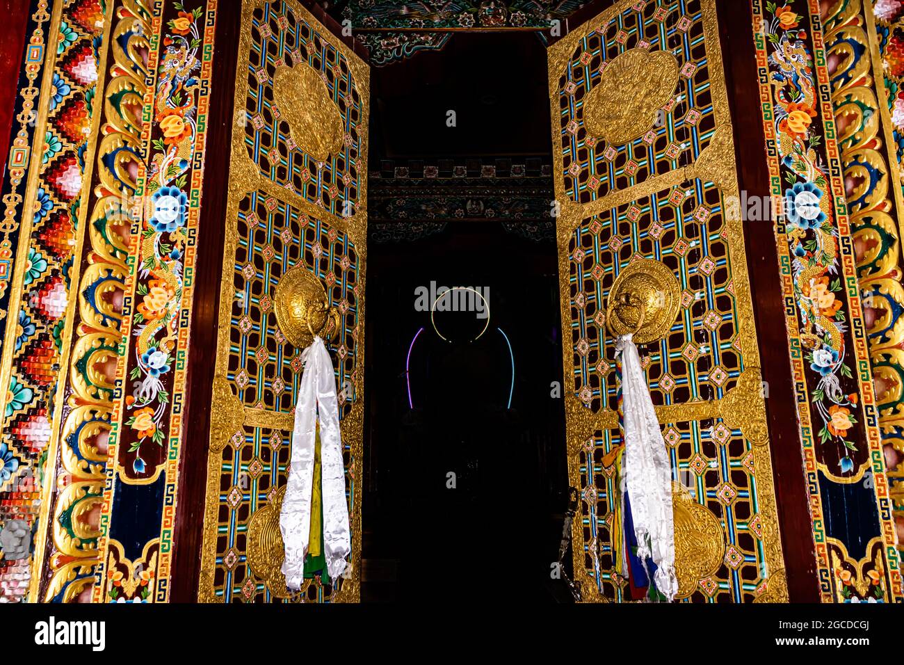 Buddhist monastery entry gate with art work at day from low angle image ...