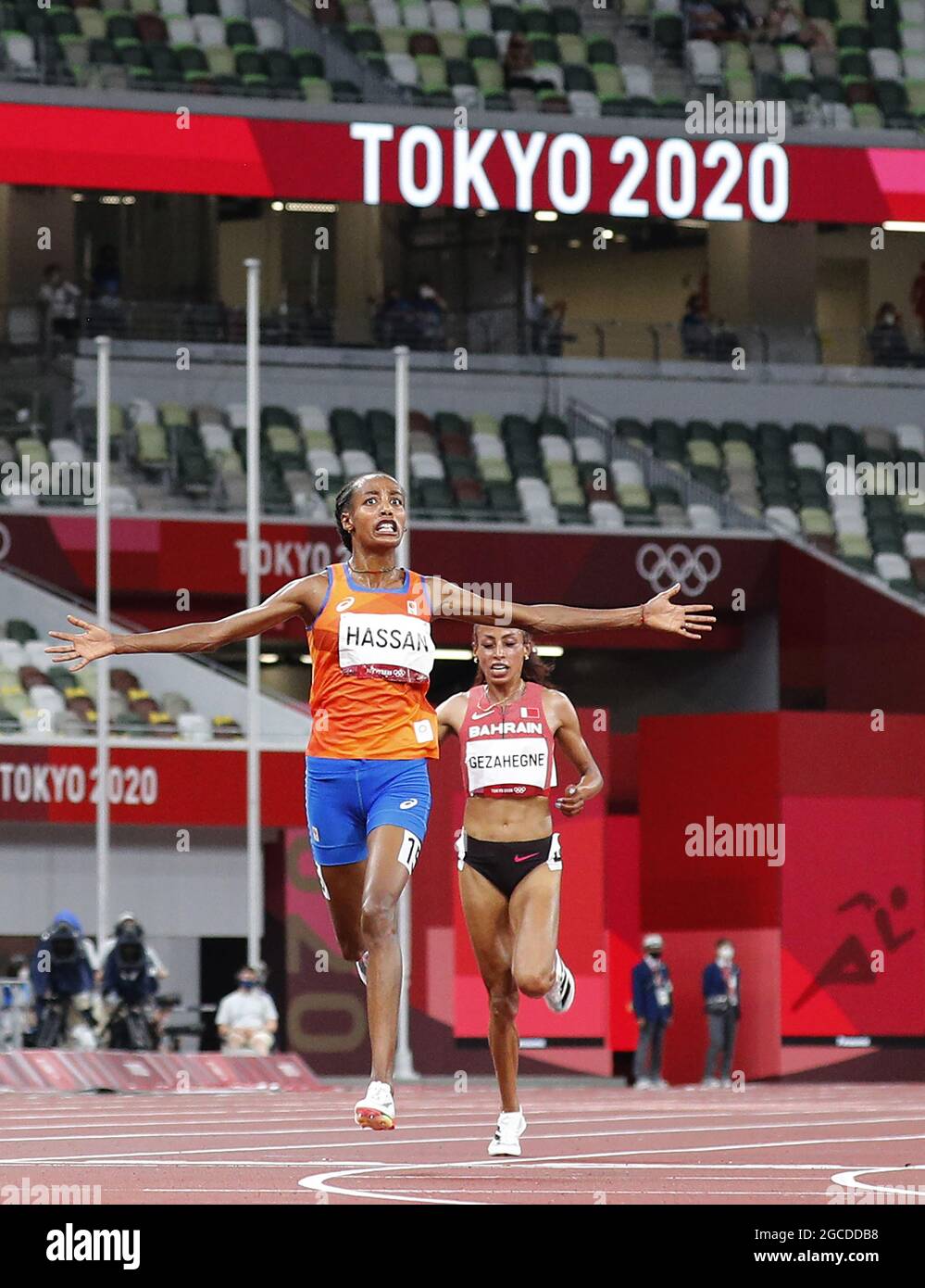 Sifan Hassan of the Netherlands and Kalkidan Gezahegne of Bahrain cross the finish line in the ...