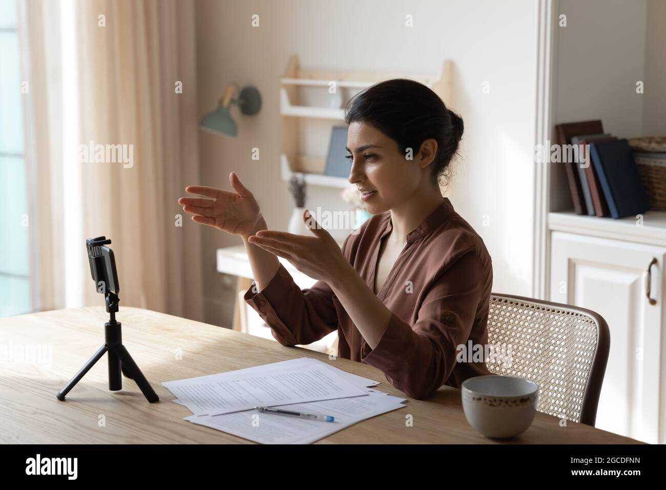 Young Indian woman talk on webcam on cellphone Stock Photo - Alamy