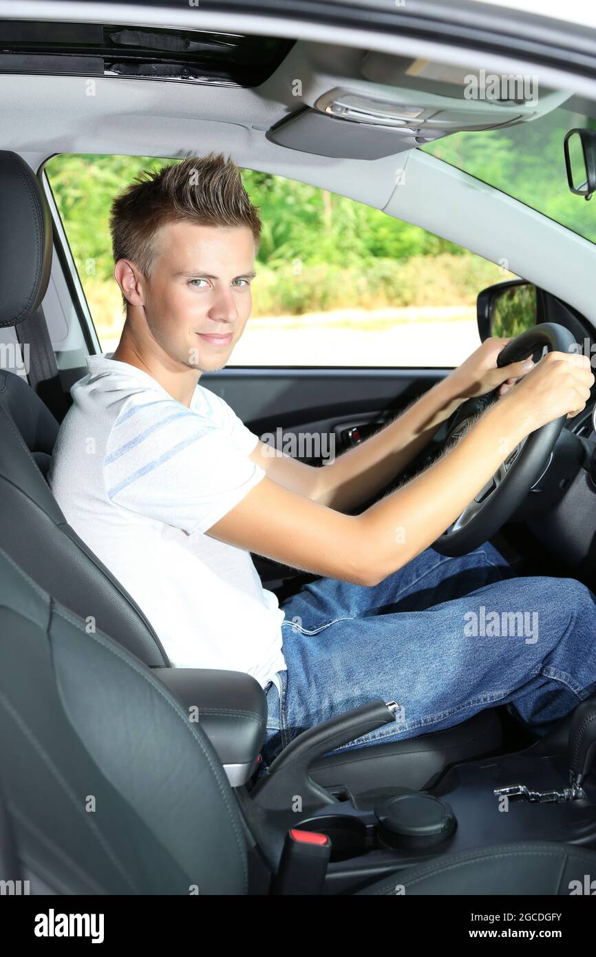 Young man in his new car Stock Photo - Alamy