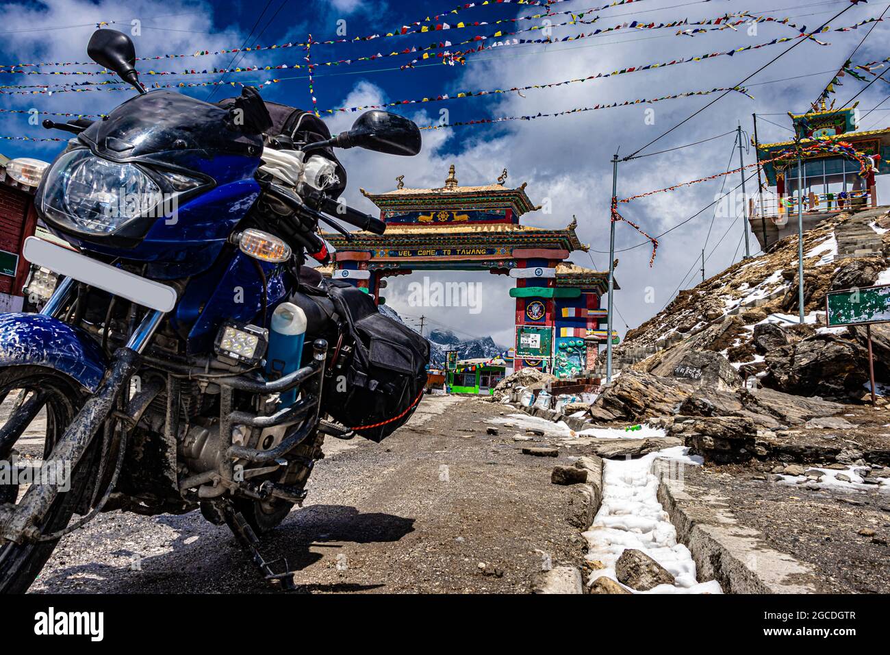 biker loaded motorcycle at mountain pass with bright blue sky at day ...