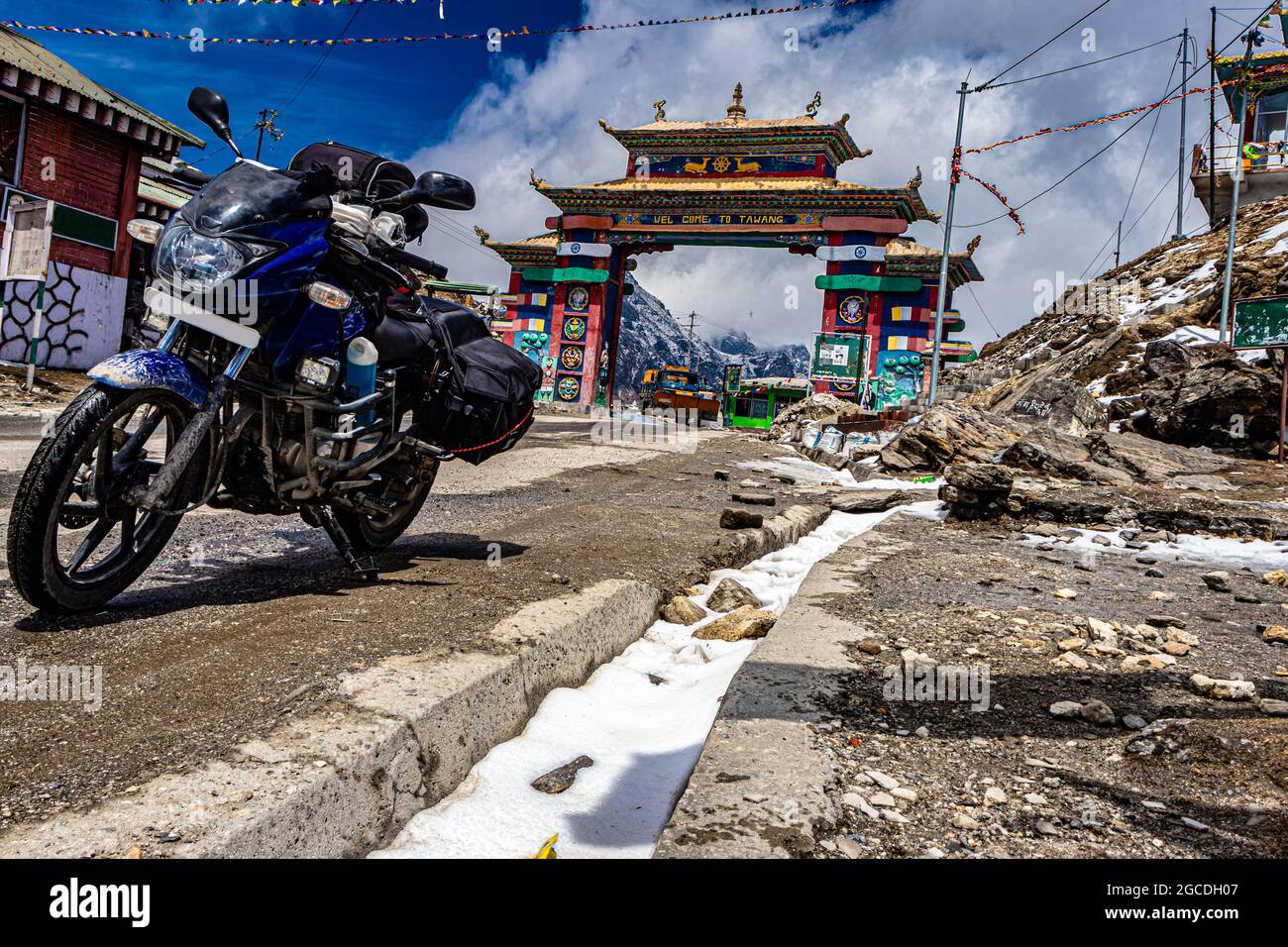 biker loaded motorcycle at mountain pass with bright blue sky at day ...