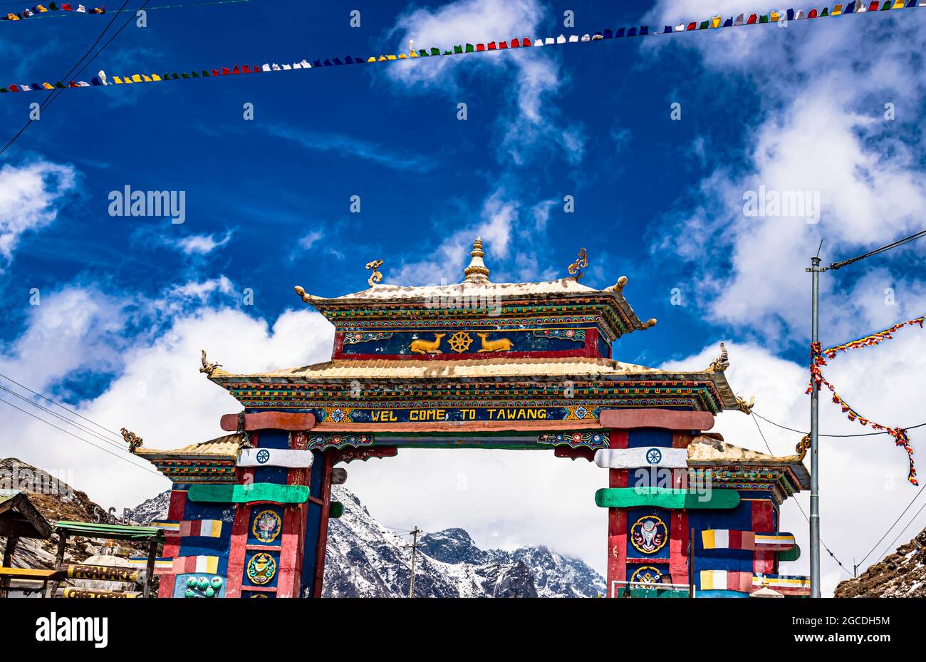 artistic buddhist decorated entry gate of city with bright blue sky at ...