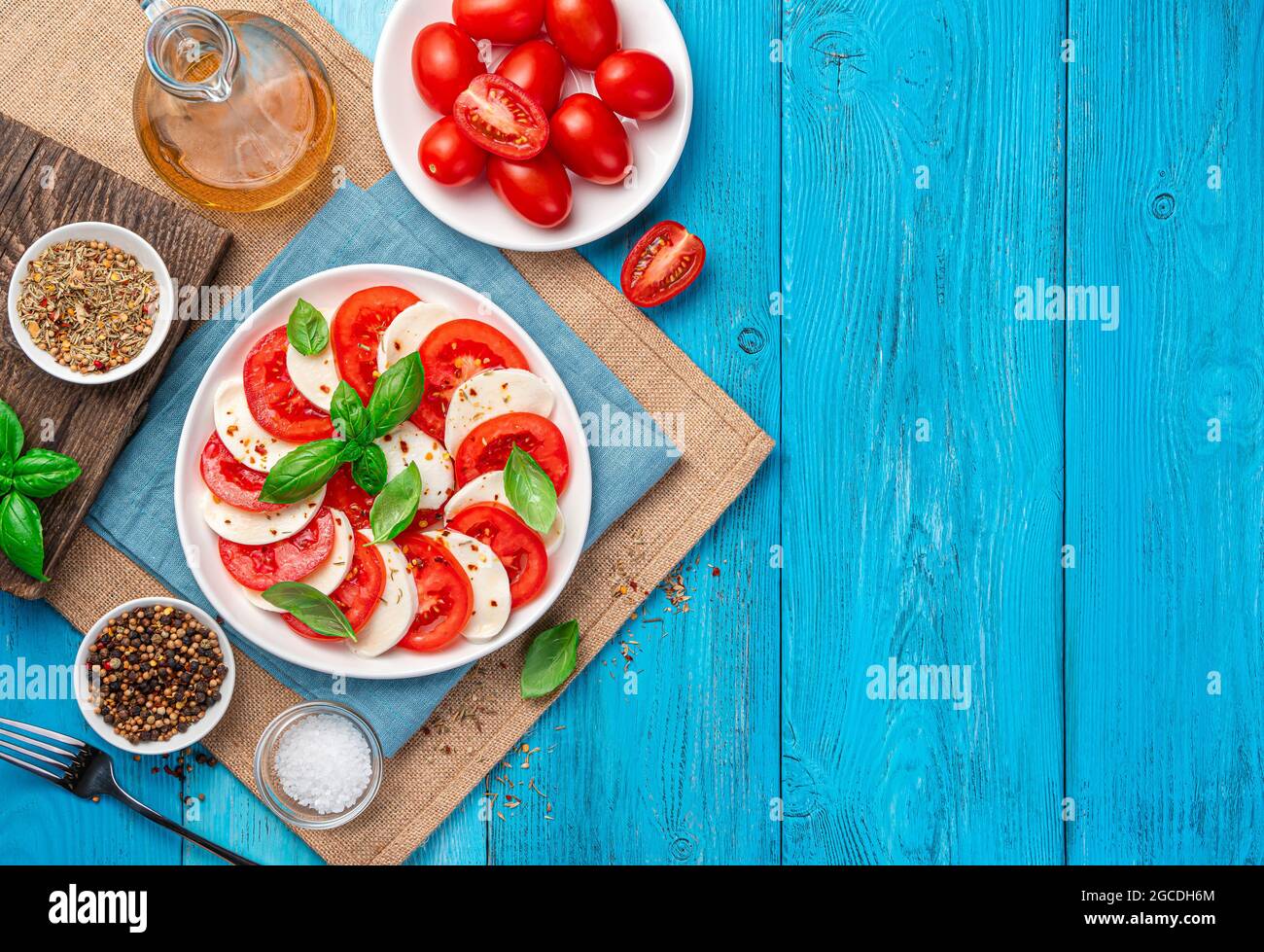 Italian caprese salad with sliced tomatoes, mozzarella cheese and fresh ...