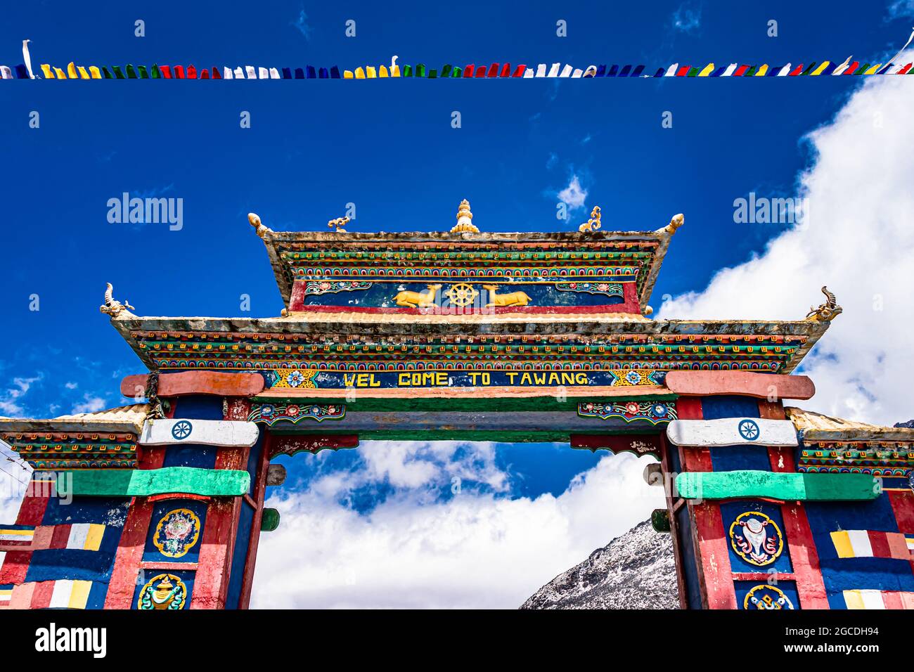 artistic buddhist decorated entry gate of city with bright blue sky at ...