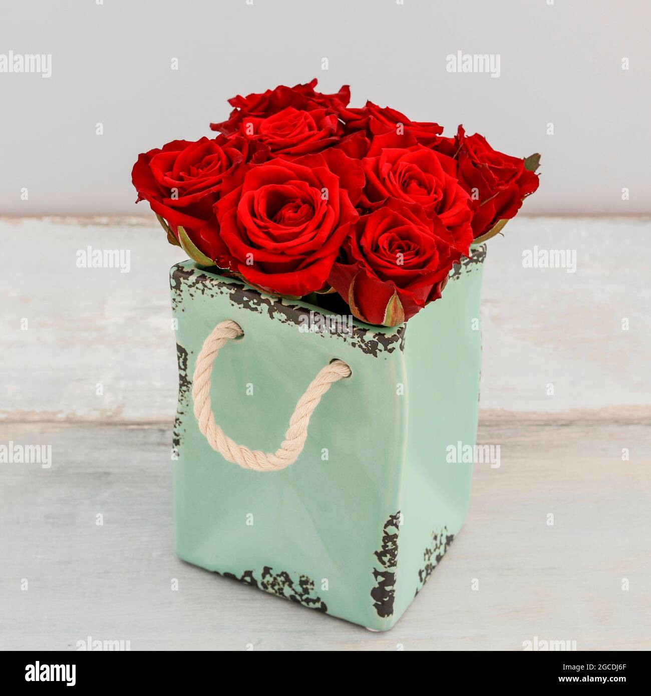 Flower box with red roses. Party decor Stock Photo - Alamy