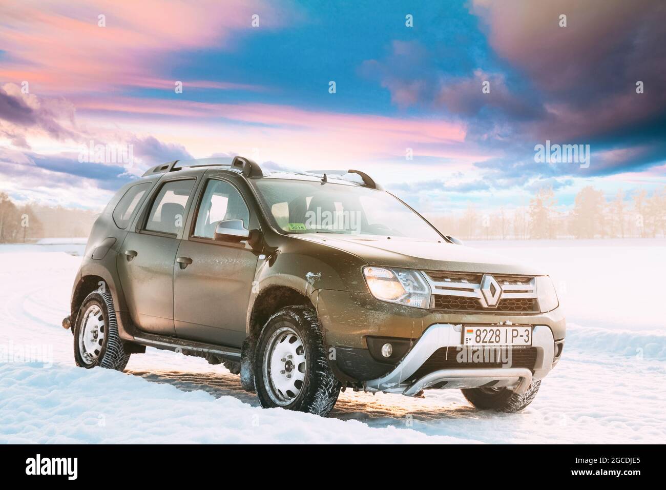 Car Renault Duster Or Dacia Duster Suv Parked On Winter Snowy Field At ...