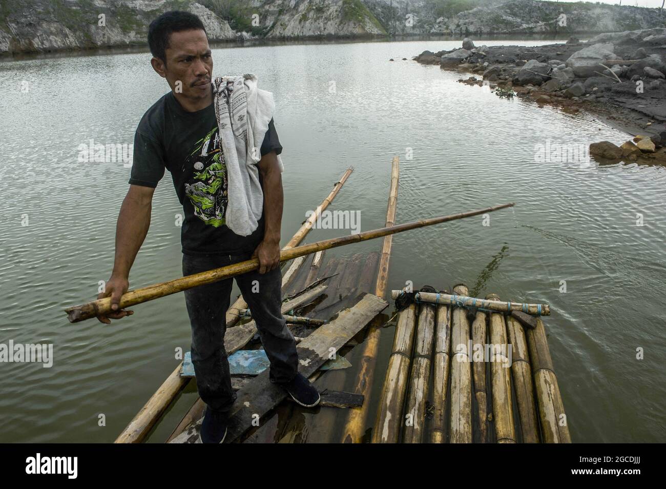 Indonesia. 08th Aug, 2021. A resident, Pirdaus Tarigan, 42, seen rowing ...
