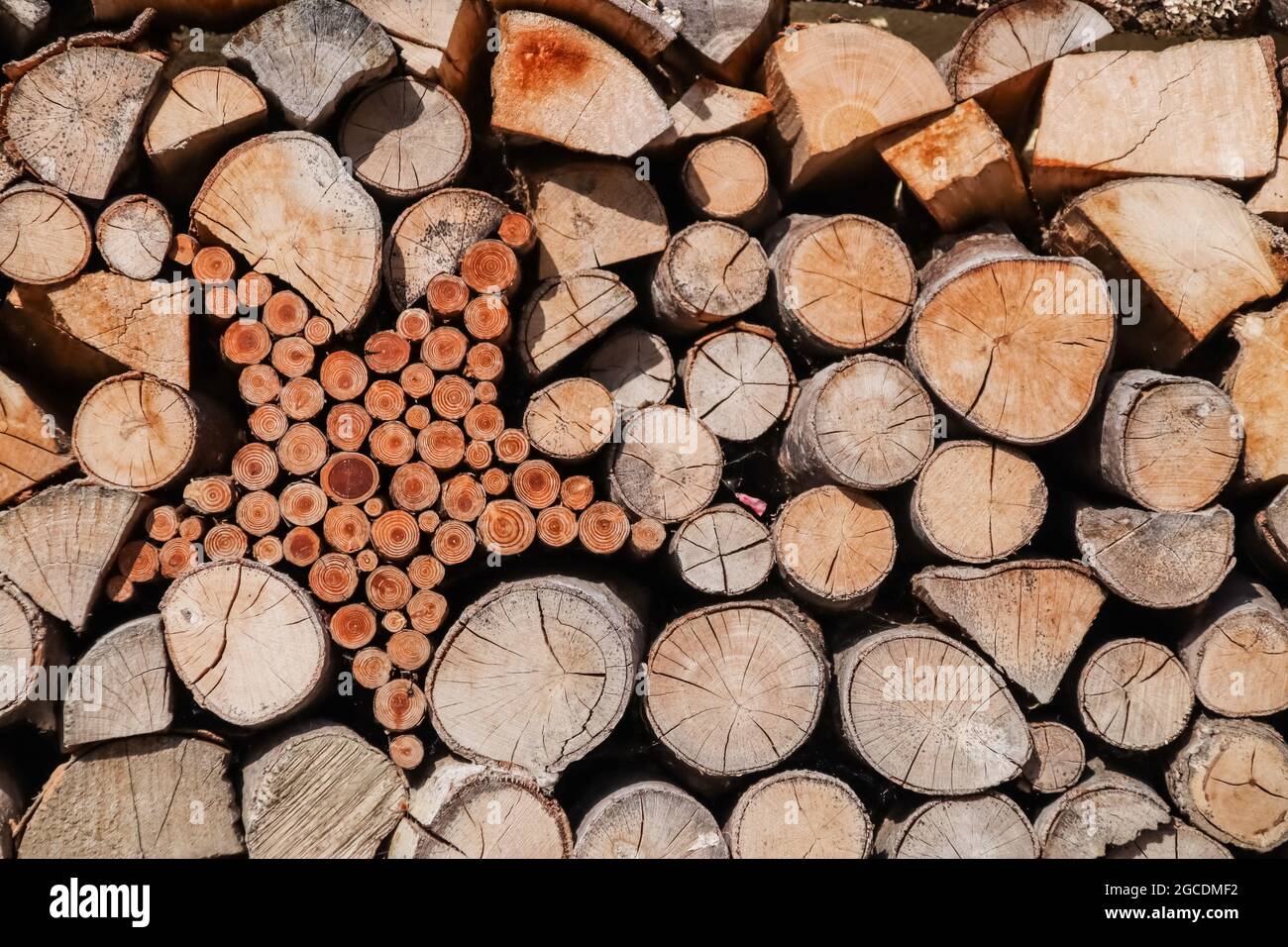 wooden stack logs arranged and star shape in a wall Stock Photo - Alamy