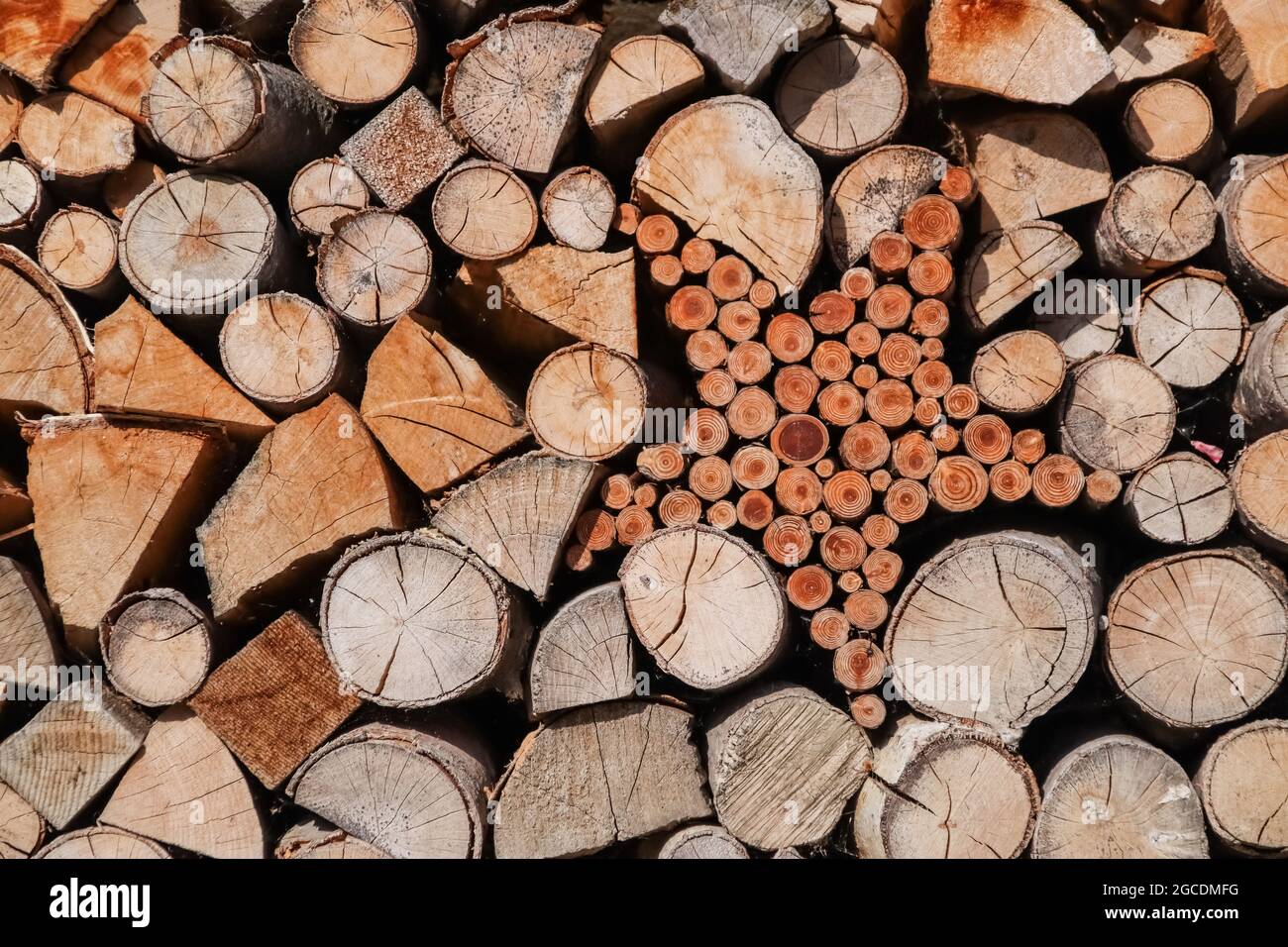 wooden stack logs arranged and star shape in a wall Stock Photo - Alamy