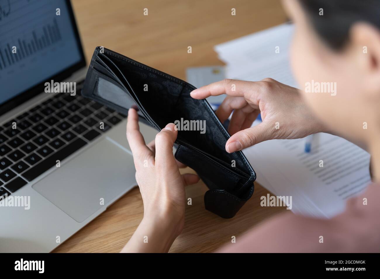 Woman hold empty wallet lack money to pay Stock Photo - Alamy